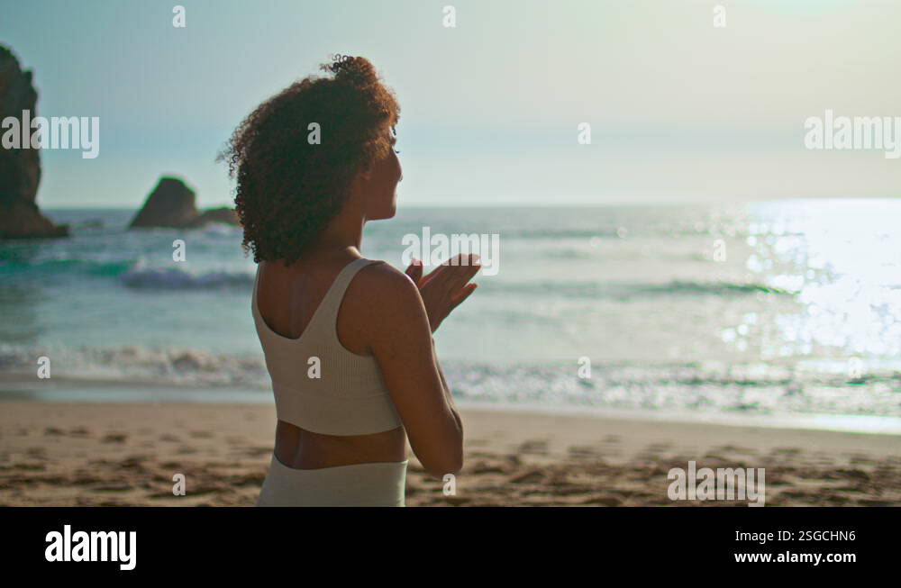 Girl sitting namaste hands looking morning sunrise close up. Woman ...