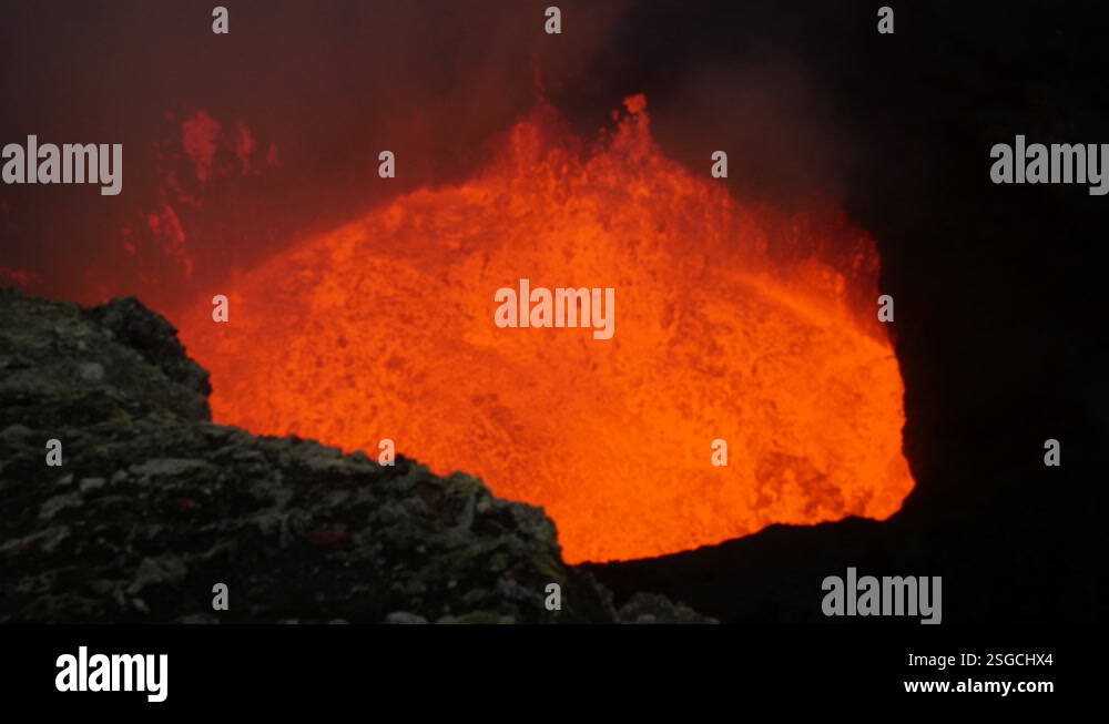 Lava Lake Erupting and Spilling Molten Lava onto the Rim of the Lake ...