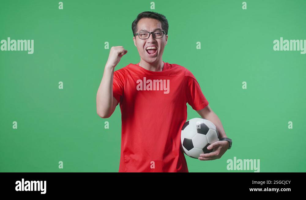 Asian Man With A Ball Screaming Goal Celebrating For The Winner Team ...
