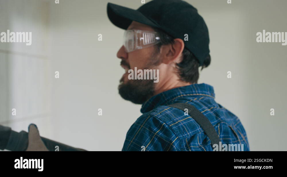 Experienced laborer working for years on construction sites renovating ...