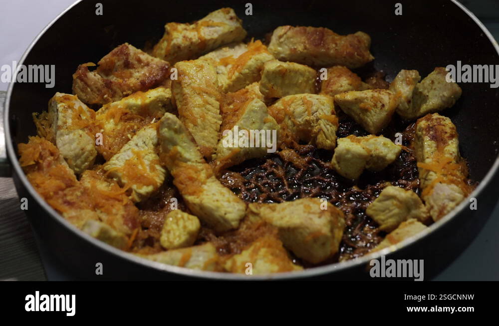 Pieces Of White Meat Are Fried In A Frying Pan On A Kitchen Stove. 60 ...