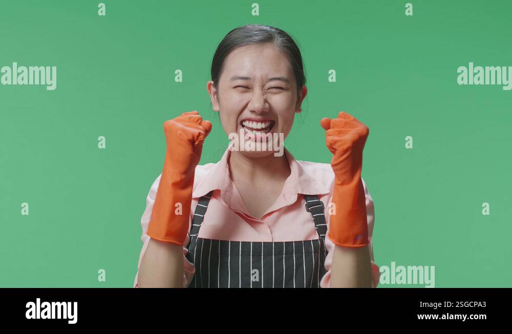 Close Up Of Happy Asian Female Housekeeper With An Apron Celebrating ...