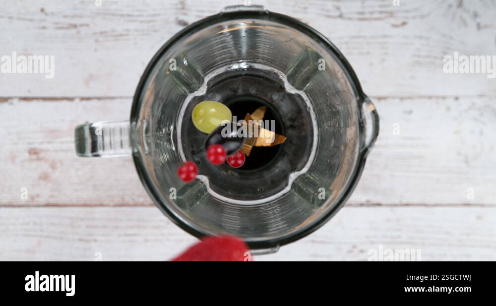 Super slow motion of mixing pieces of fruits in blender Stock Video ...