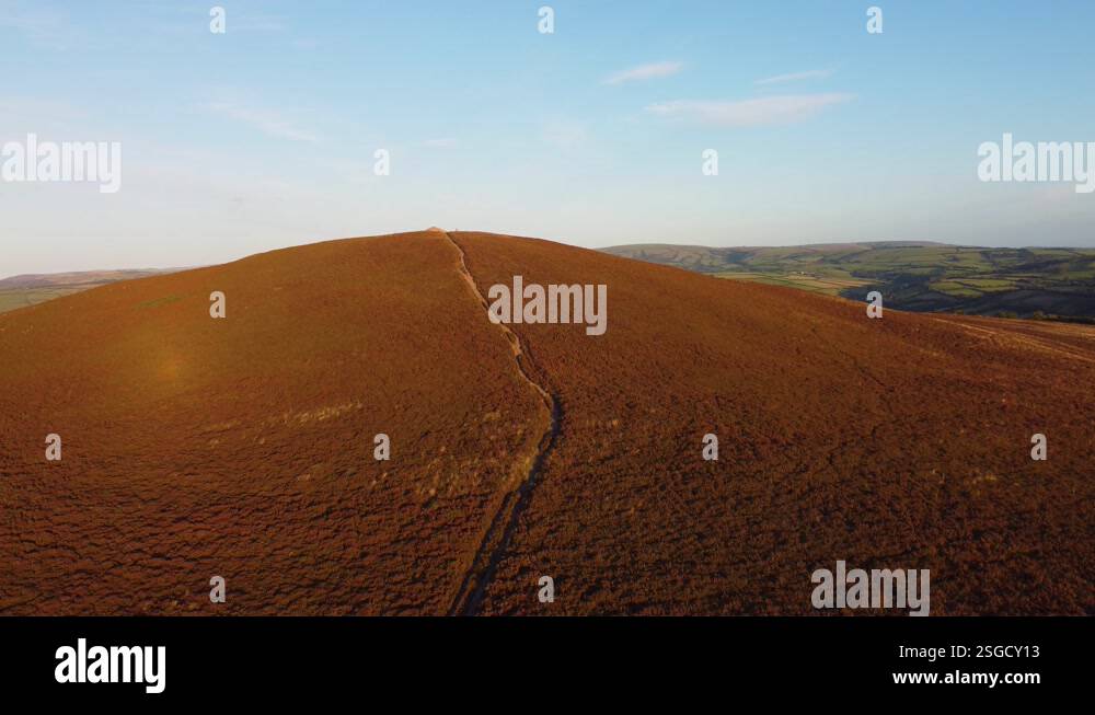 Beautiful Sunset Rising Aerial Drone Footage Over Moorland with Hiker ...