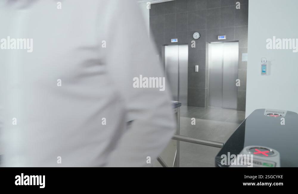 Pass system at the entrance to the office building, the gray-haired ...