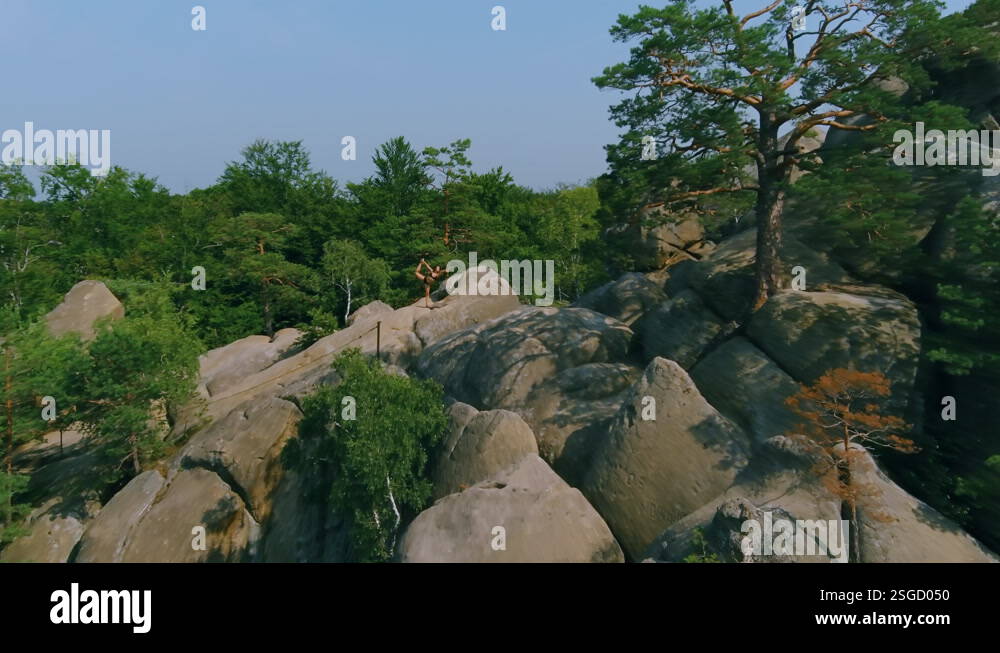 Beautiful woman stretches body takes away raises leg. Concept of sport ...