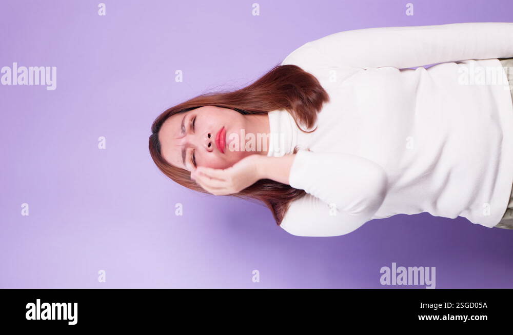 Vertical of Frustrated stressed young Asian woman coping with emotions ...