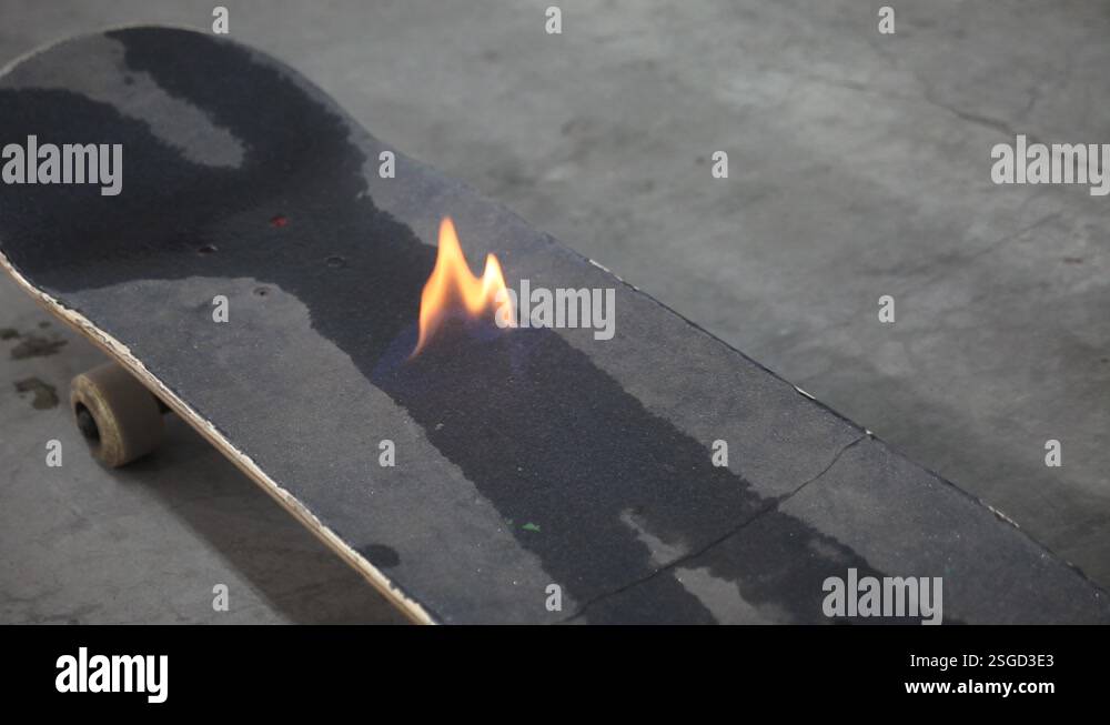 Skateboard Lit on Fire Stock Video Footage - Alamy