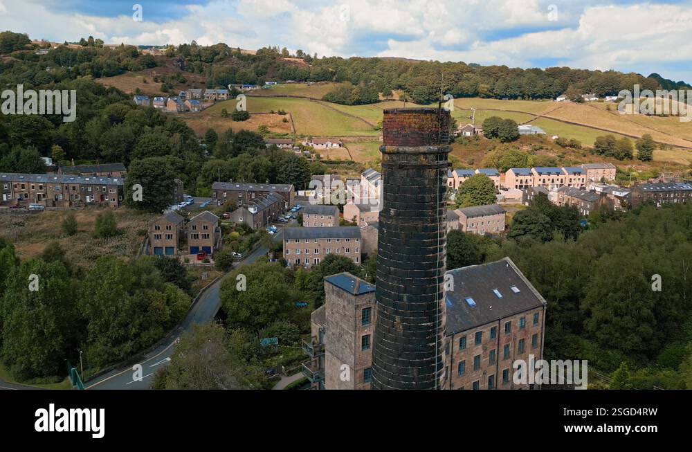 Drone footage of a old mill chimney stack, With footage rotating around ...