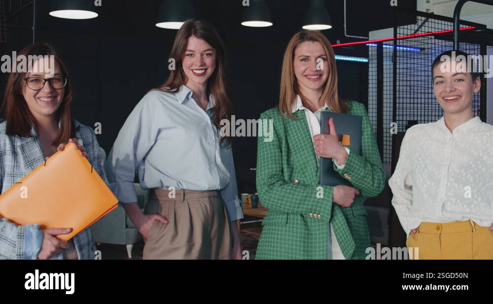 GIRL POWER Four beautiful happy business women, team of office workers ...