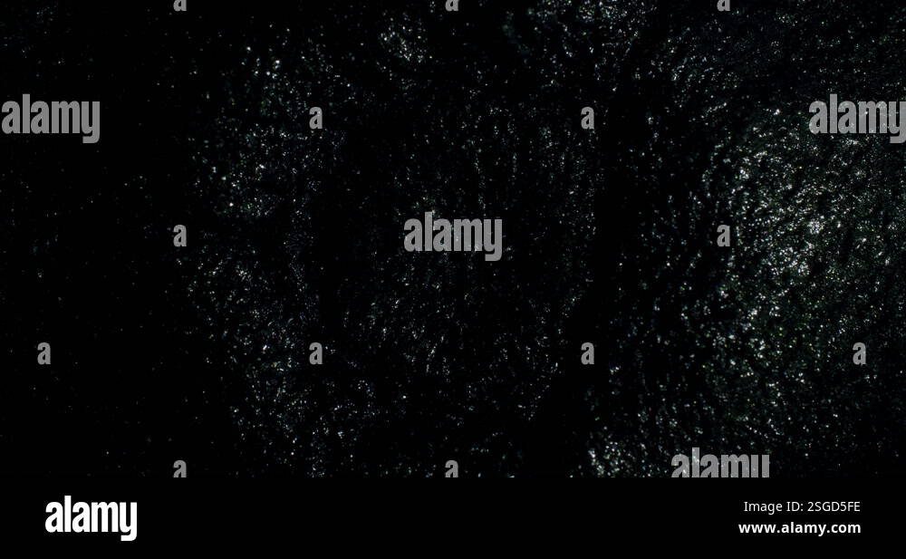 Slow moving sparkly circular shape as it moves both outwards and ...