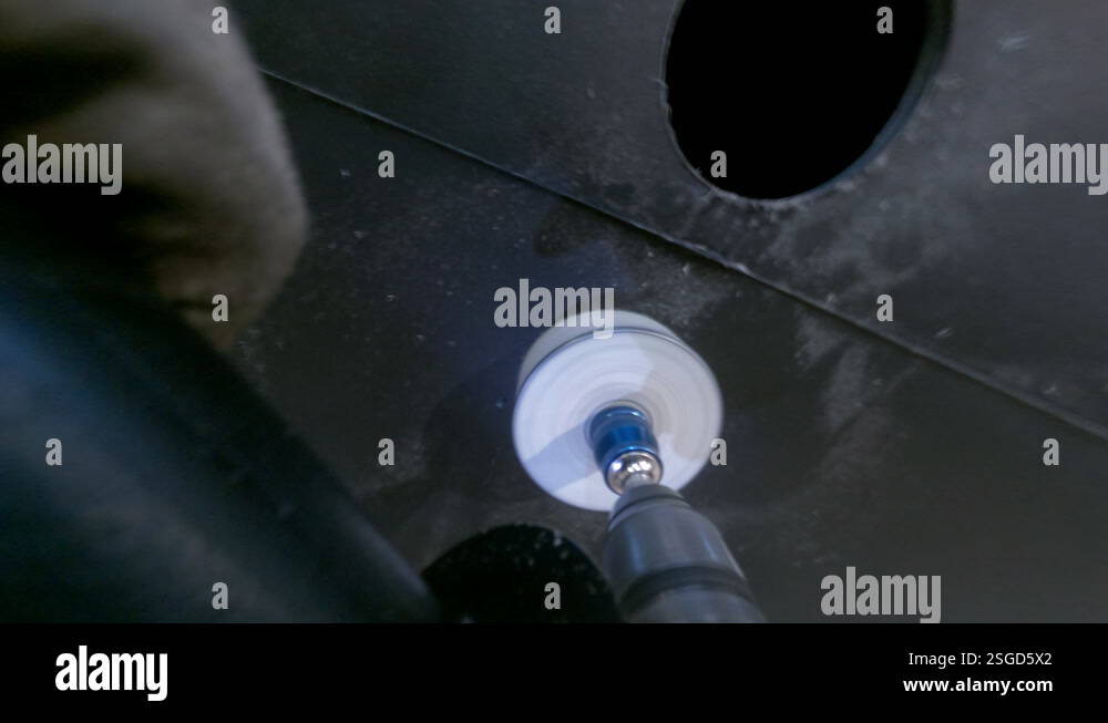 A Hole Saw Drilling Holes In A Water Tank, Plastic Rotomolding Stock ...