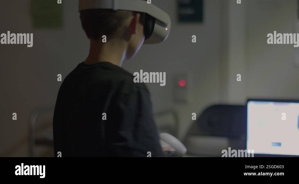 He controls the controllers in his hands, the use of a button Stock ...