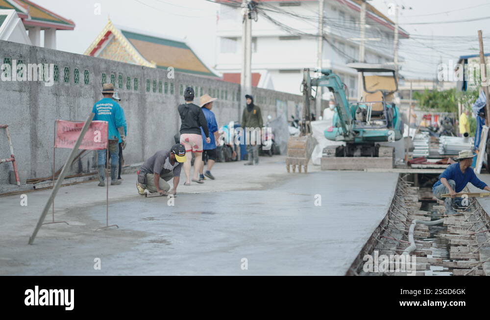 Manual Laborers At Work On Road And Drainage Construction Site In ...