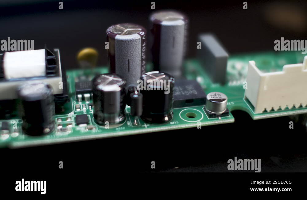 Close Up View Of Radial Electrolytic Capacitors Mounted On PCB. Slow ...