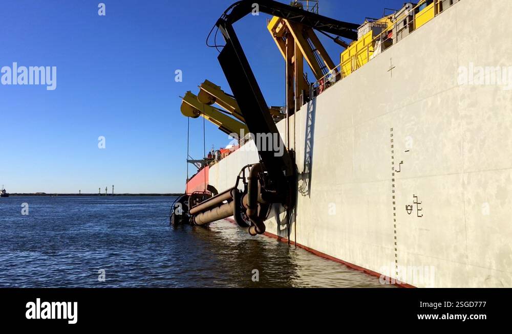A static shot of cutter suction dredger at work of land reclamation for ...