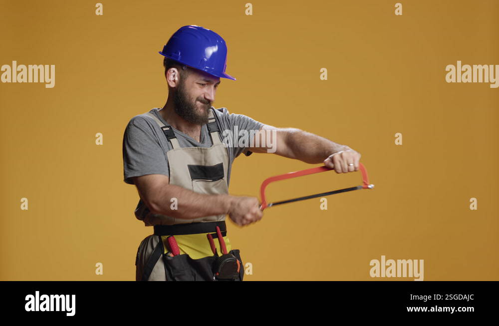 Handyman mechanic using saw with razor used for chopping wood Stock ...