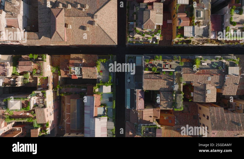 Overhead ascending shot of old residential houses and narrow streets in ...