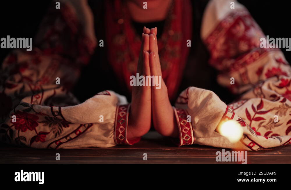 Ukrainian woman reading old book - Holy Bible and praying. Lady in traditional Stock Video ...