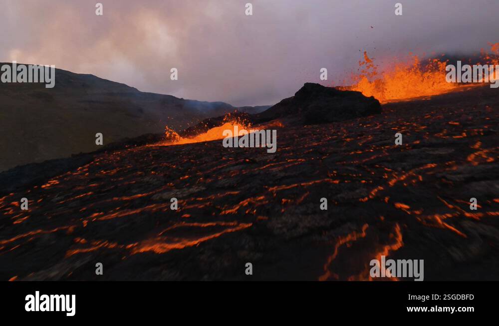 FPV drone shot over a bubbling molten lava cauldron in the Icelandic ...