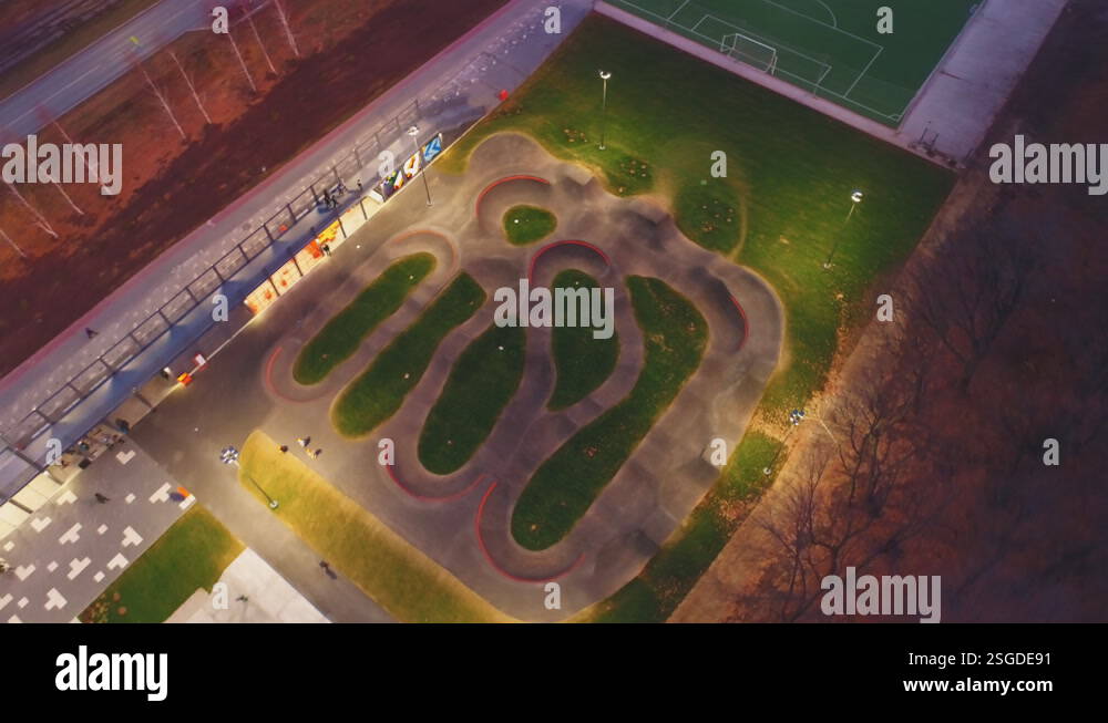 Cycling tracks and skating ramps in large city park at night Stock ...