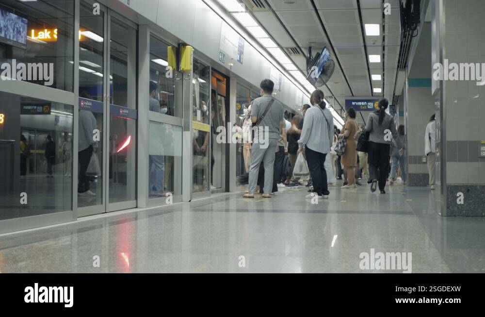 passenger waiting and get into subway train in the subway train station ...