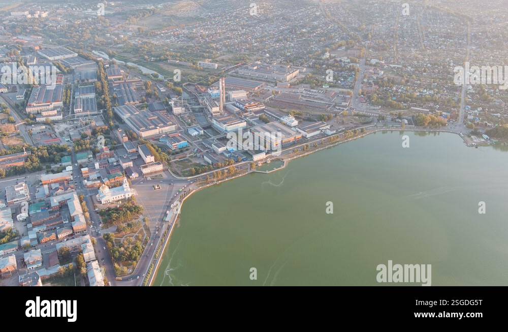 Russia, Votkinsk. Embankment with a dam and factories. Votkinsk is a ...