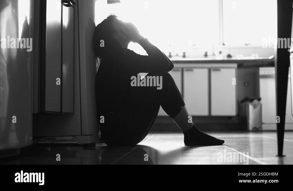 Woman covering face remembering trauma. Black and white monochromatic ...