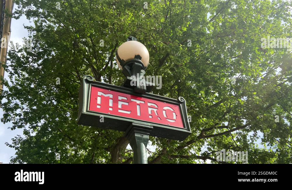 Iconic Metro Sign In The City Of Paris, France. - low angle Stock Video ...