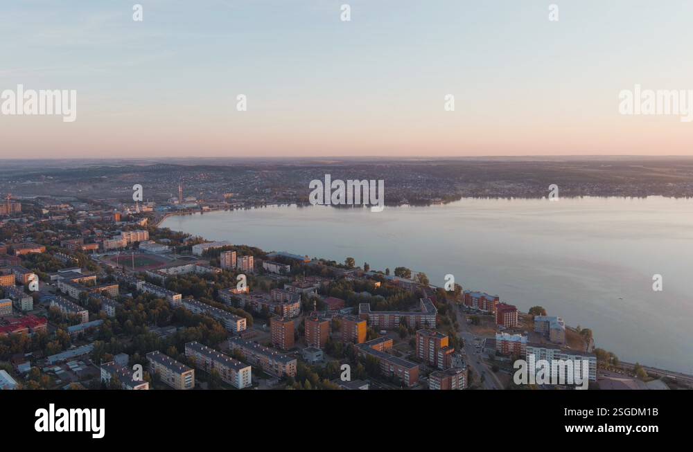 Russia, Votkinsk. Embankment with a dam and factories. Votkinsk is a ...
