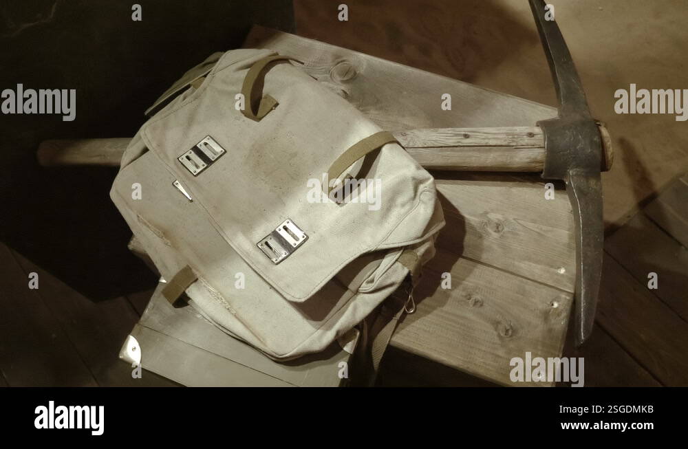 Retro backpack, a pickaxe of an archaeologist - an antiquities hunter ...