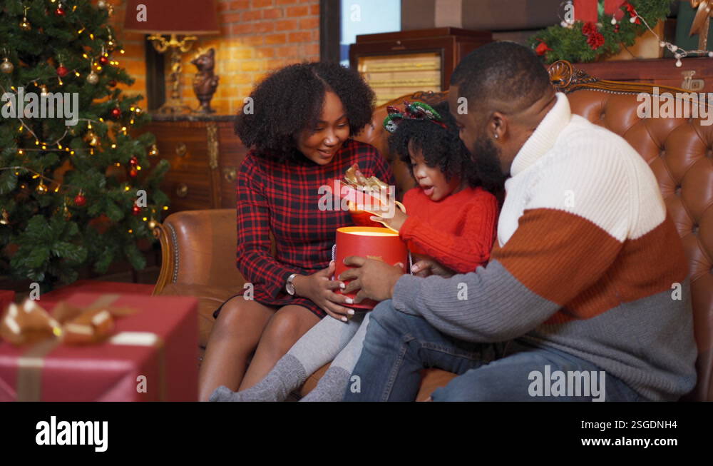 An African American black family, woman, father, mother and kid girl ...