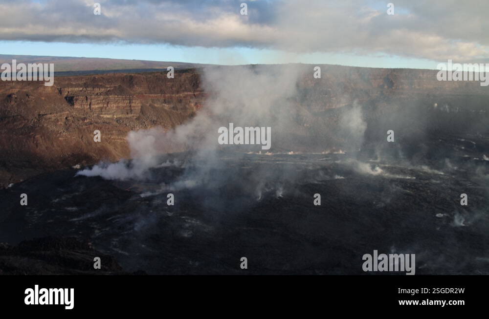 The crater rim of the Kilauea volcano with an active volcanic eruption ...