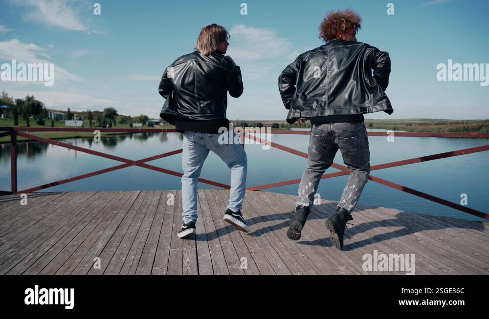 Two Ukrainian guys dance modern dance in nature Stock Video Footage - Alamy