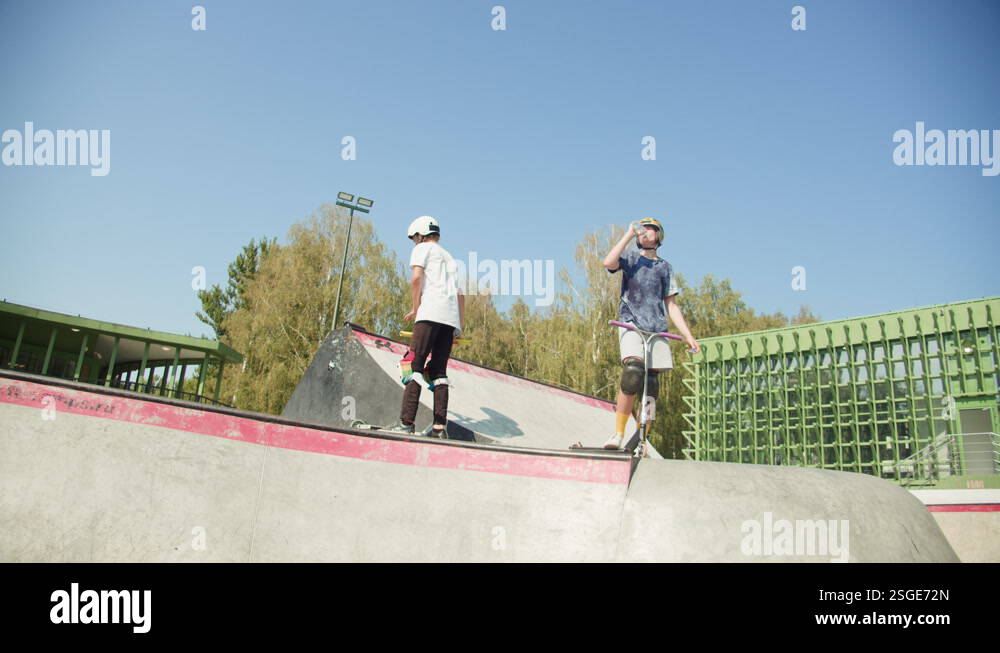 Man making trick on kick scooter in concrete bowl, air extreme in skate ...