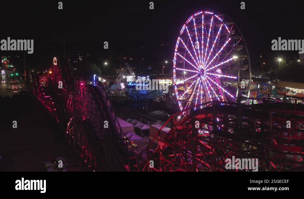 Ferris Wheel And Roller Coaster Ride At Night In Washington State Fair ...