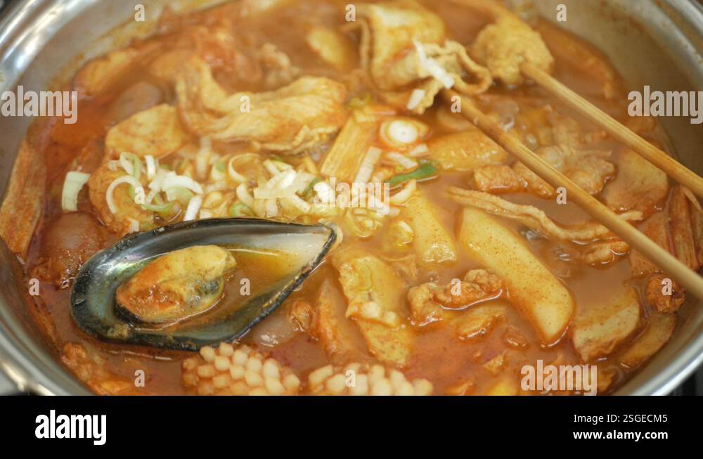 close up to the Korean Kimchi soup with squid,mussels,fish tofu and ...
