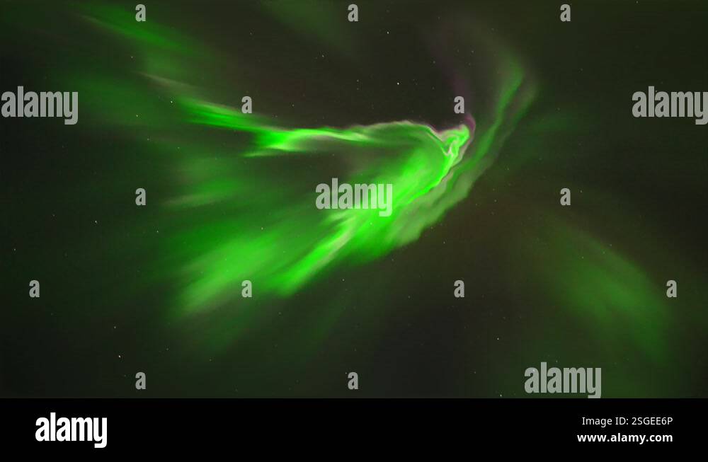 Handheld bottom up of Aurora Borealis Explosion in green color at star ...