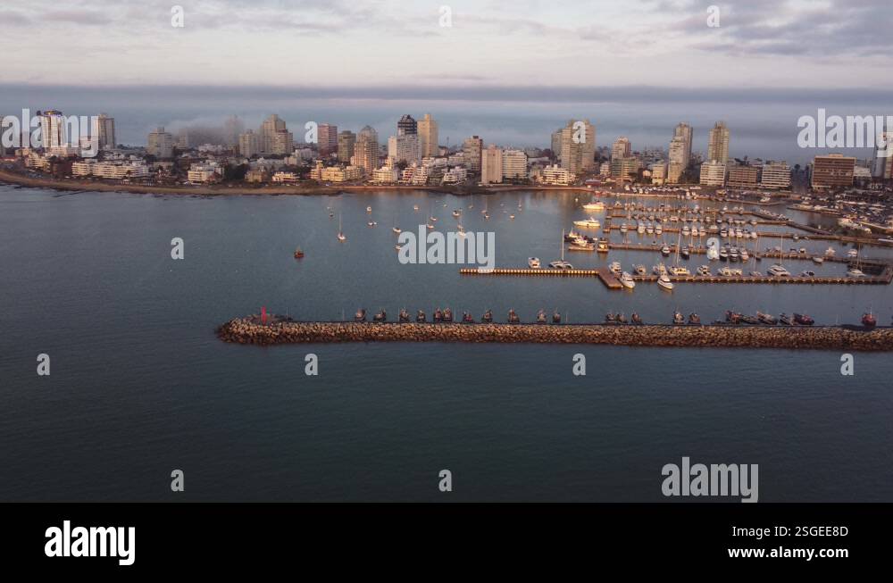 Birds eye view of cruise port and breakwaters at seaside city of Punta ...