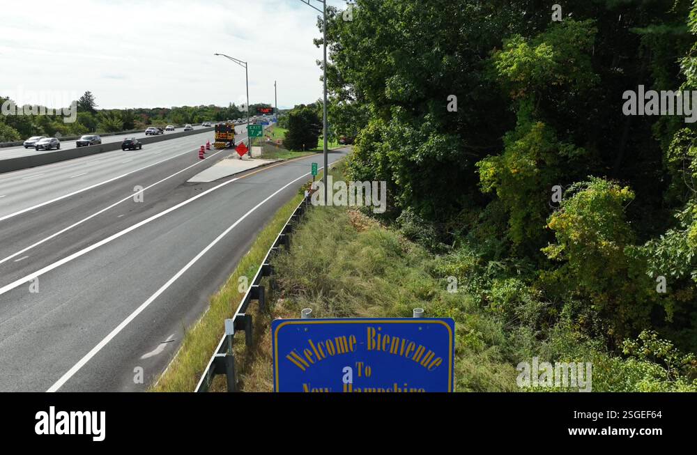 State border of New Hampshire along busy highway. Maine and NH state ...