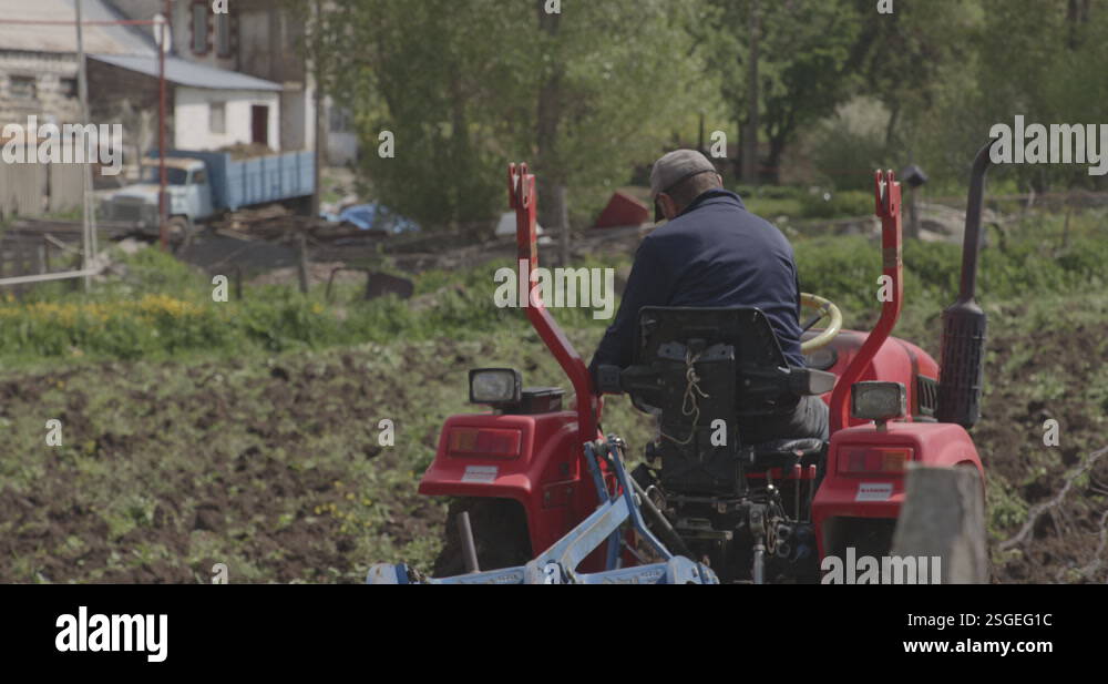Farmer using red tractor Stock Videos & Footage - HD and 4K Video Clips ...