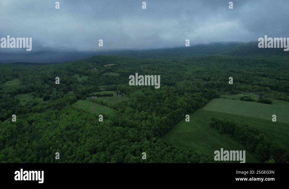 4K aerial of a big storm and dark clouds over the Green Mountains in ...