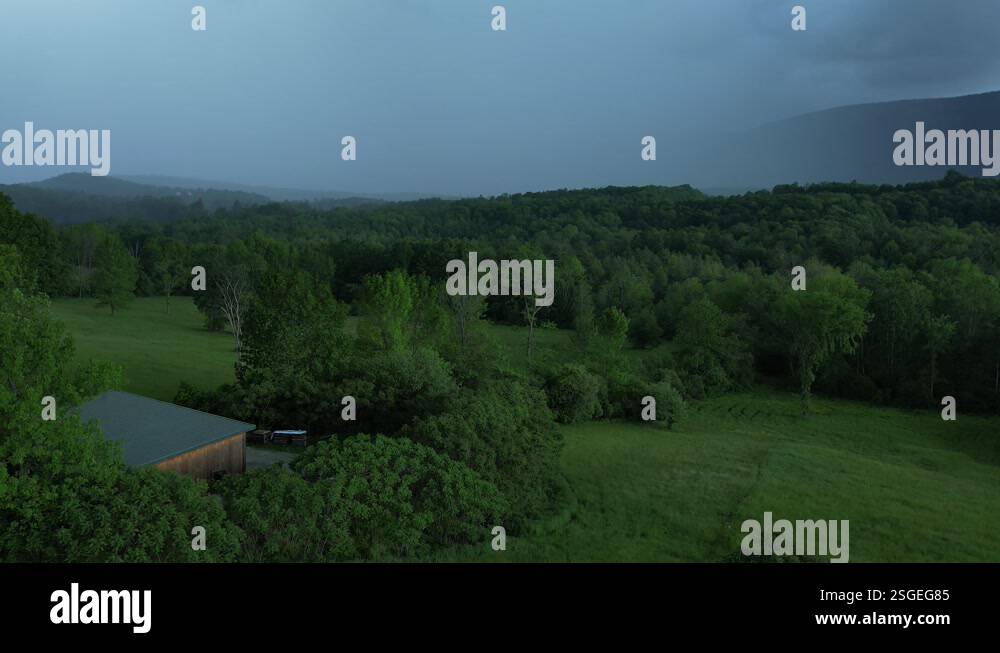 4K aerial of a big storm and dark clouds over the Green Mountains in ...