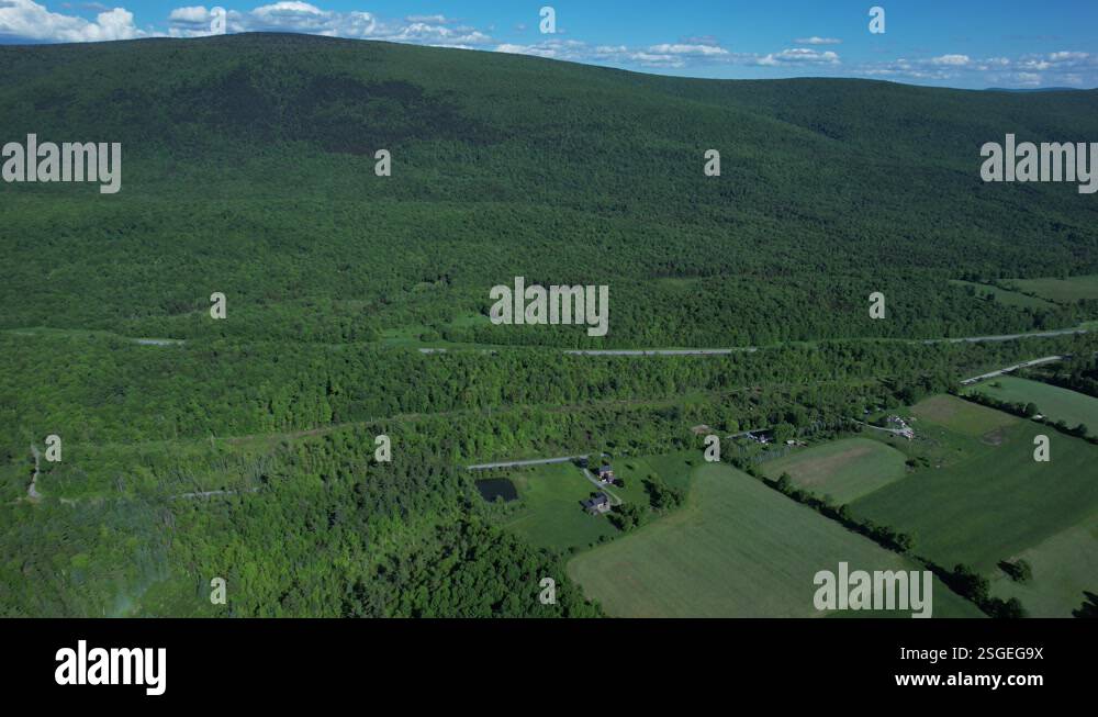 4K aerial over the beautiful Green Mountains in rural Vermont, summer ...