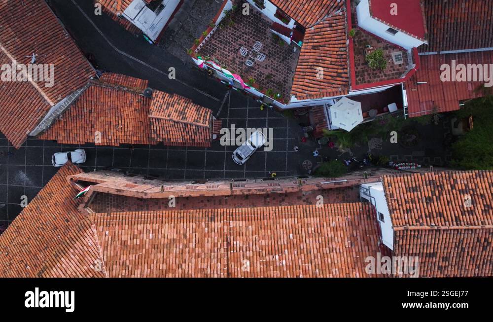 Vehicles and people on tight streets of Taxco Guerrero, Mexico ...
