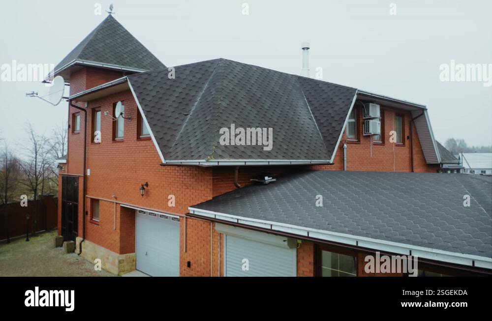 Multilevel pitched soft roof with a ventilation shaft. The building ...