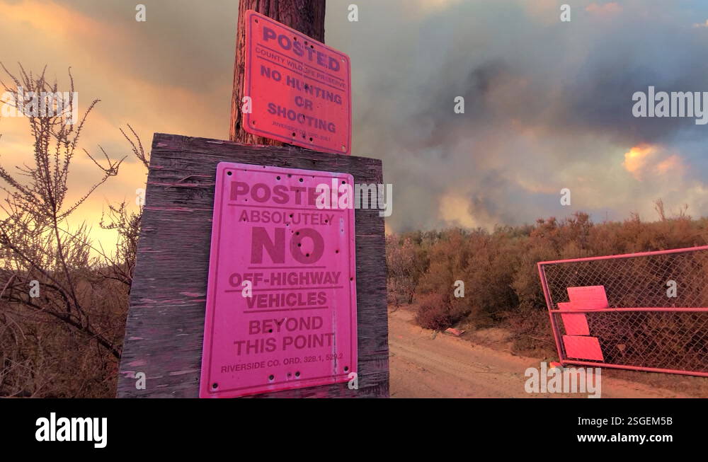 No Off-Highway Vehicles Allowed sign and no hunting sign on a wooden ...