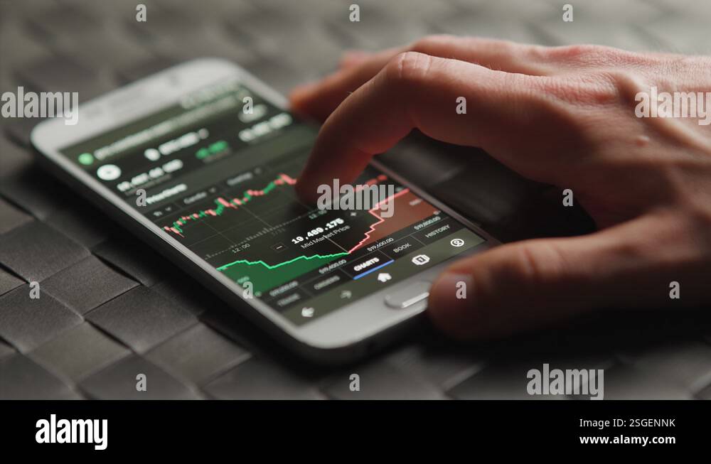 Man scrolling through candlestick chart on his phone. Economics and Stock Video Footage - Alamy