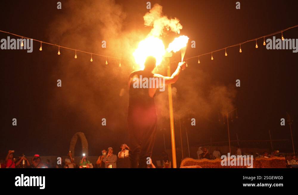 Fire breathers spit fuel to ignite fireballs in festival in Dubai, UAE ...
