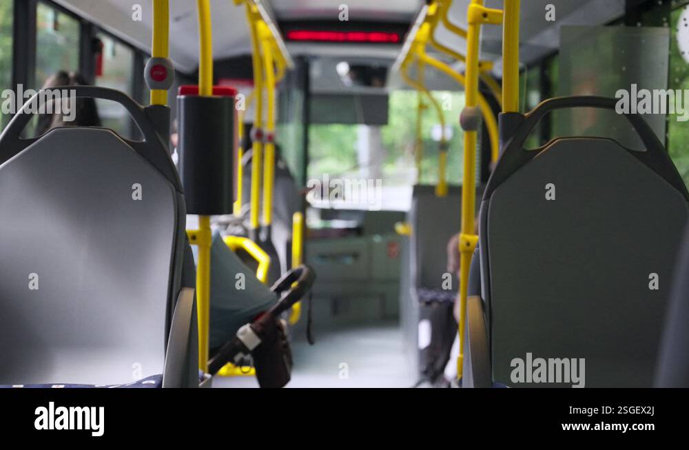 European bus ride from inside of vehicle driving through small suburban ...